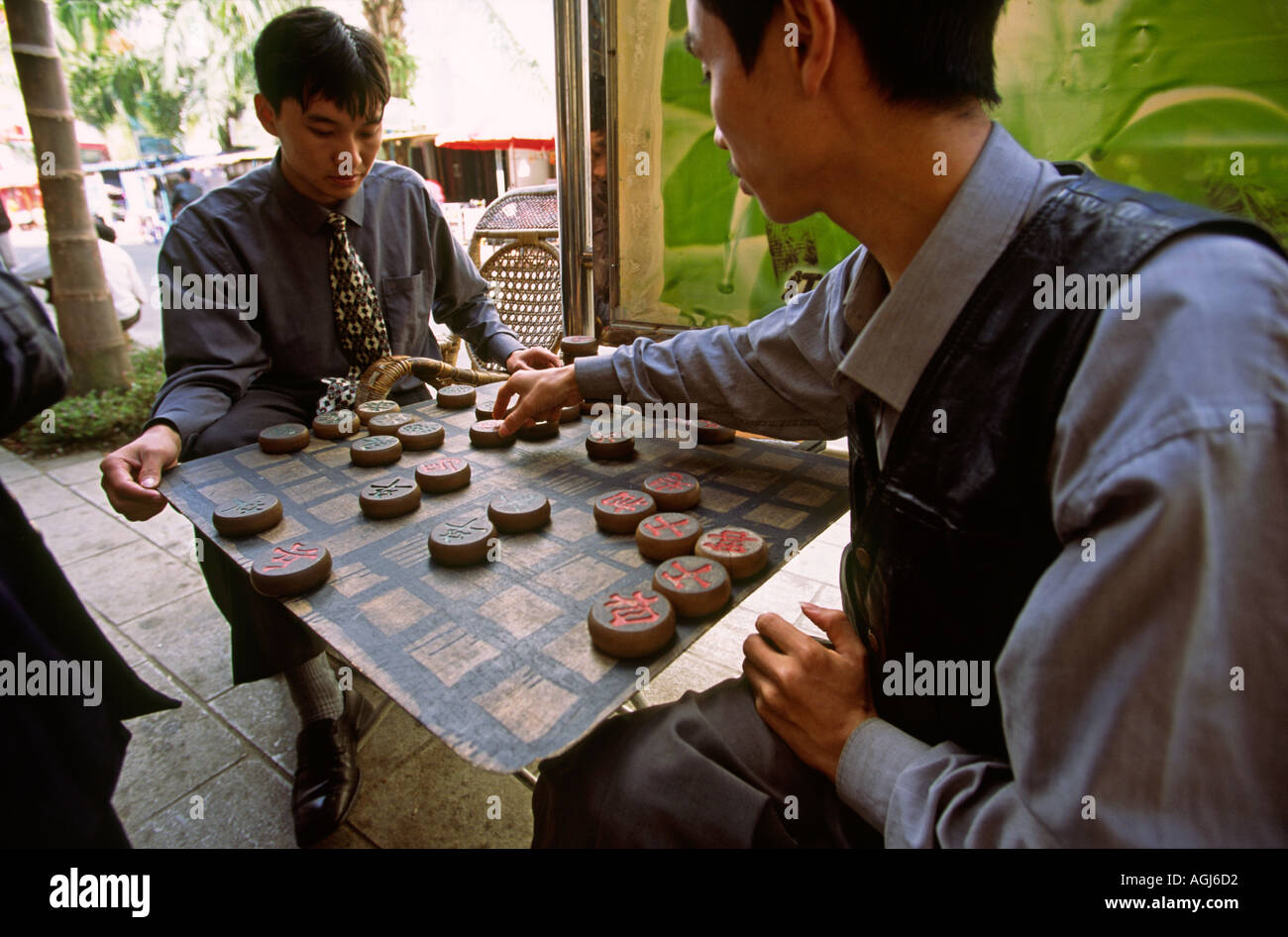 China Yunnan pastimes Jinghong men playing xiangqi Chinese chess Stock ...