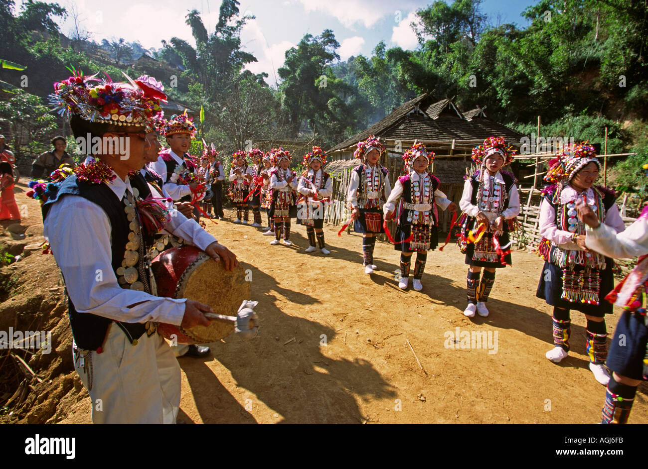 China Yunnan Xiao Hu La Akha Hani village festival dancers greeting ...