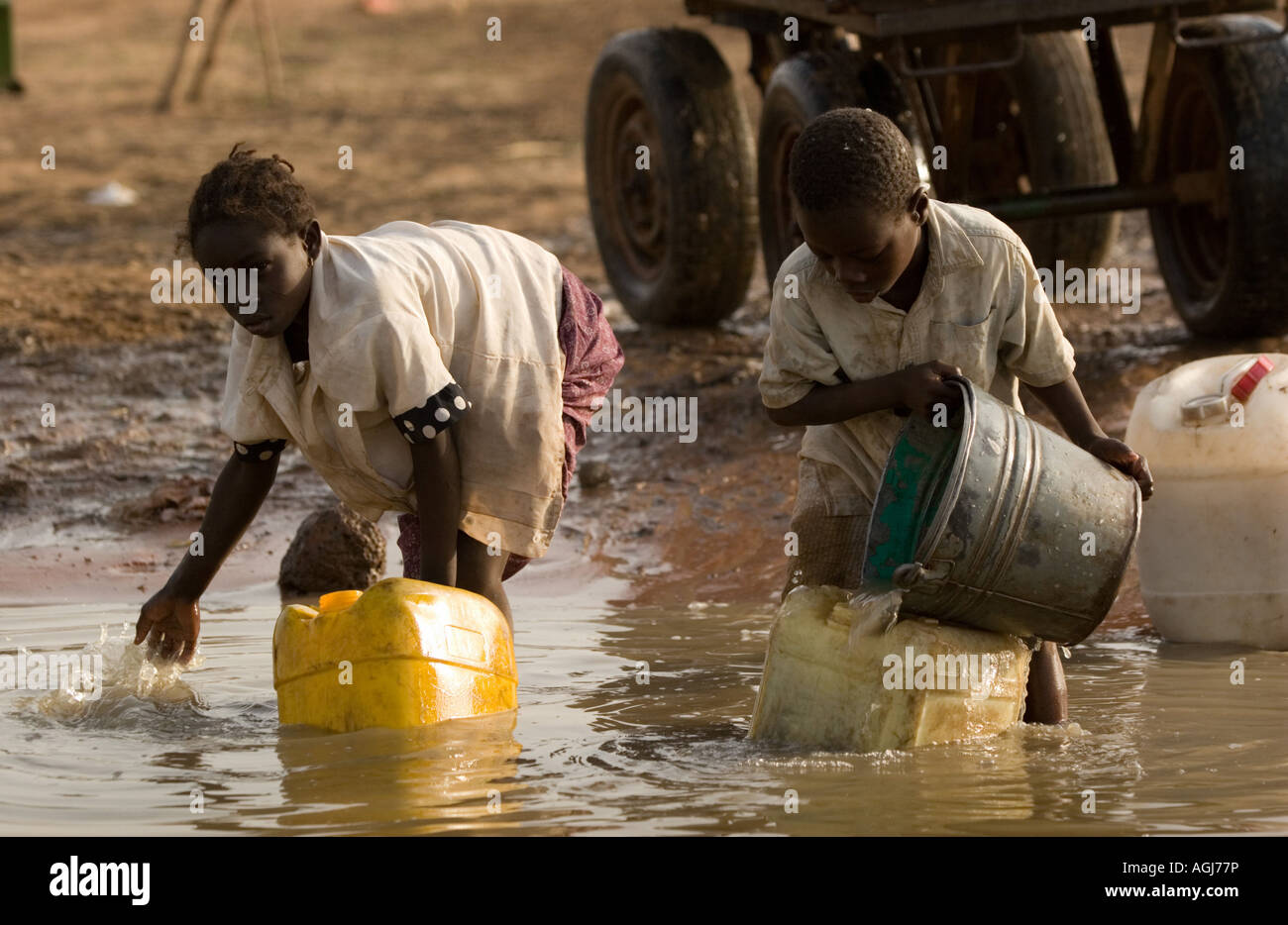 Children with water africa hi-res stock photography and images - Alamy