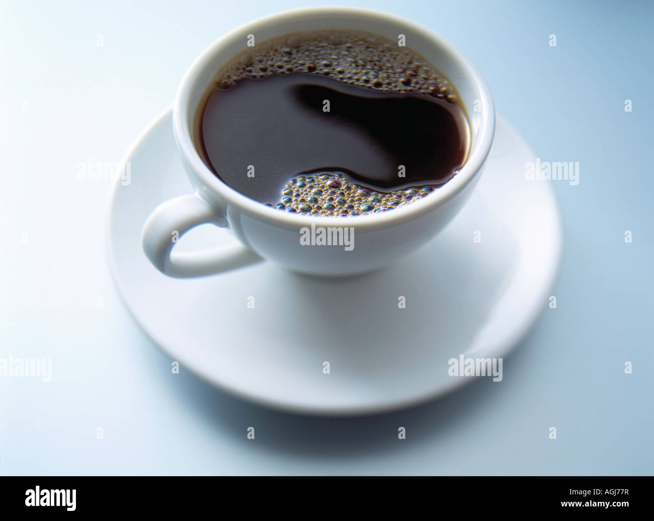 Black coffee in a small white cup and saucer Stock Photo - Alamy