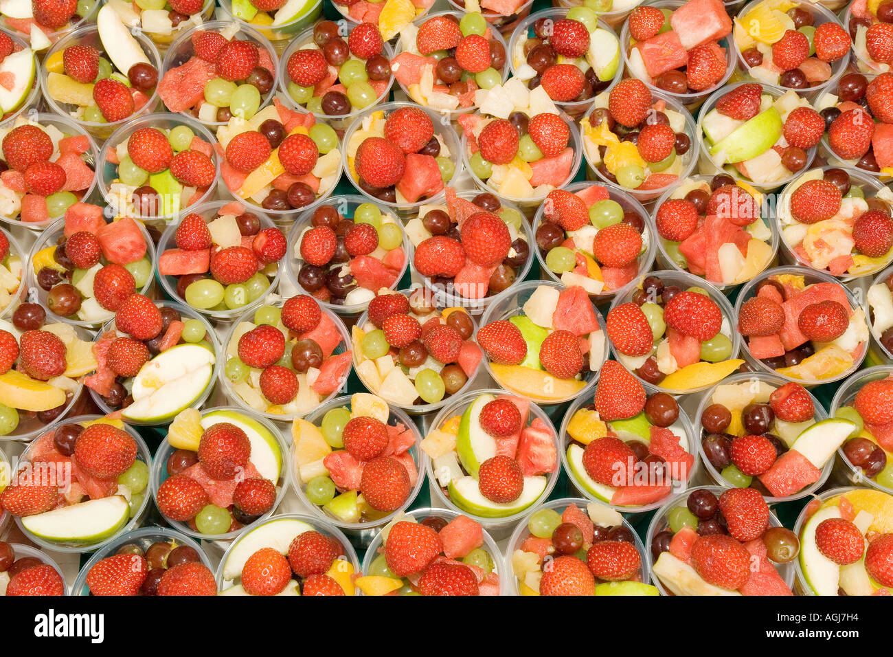 Plastic cupfuls of fresh tasty summer fruits Stock Photo - Alamy