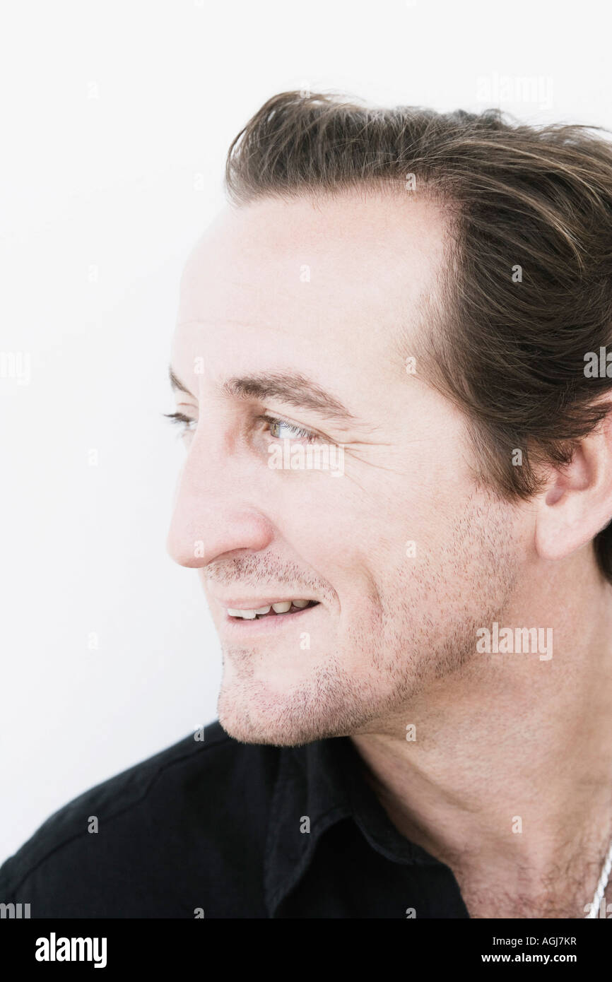Close-up of a mid adult man smiling Stock Photo - Alamy