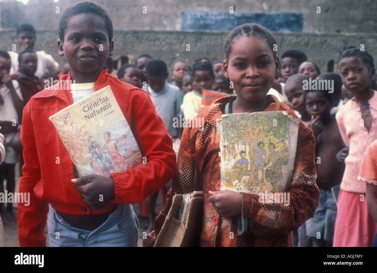Children with textbooks in Mozambique Stock Photo - Alamy