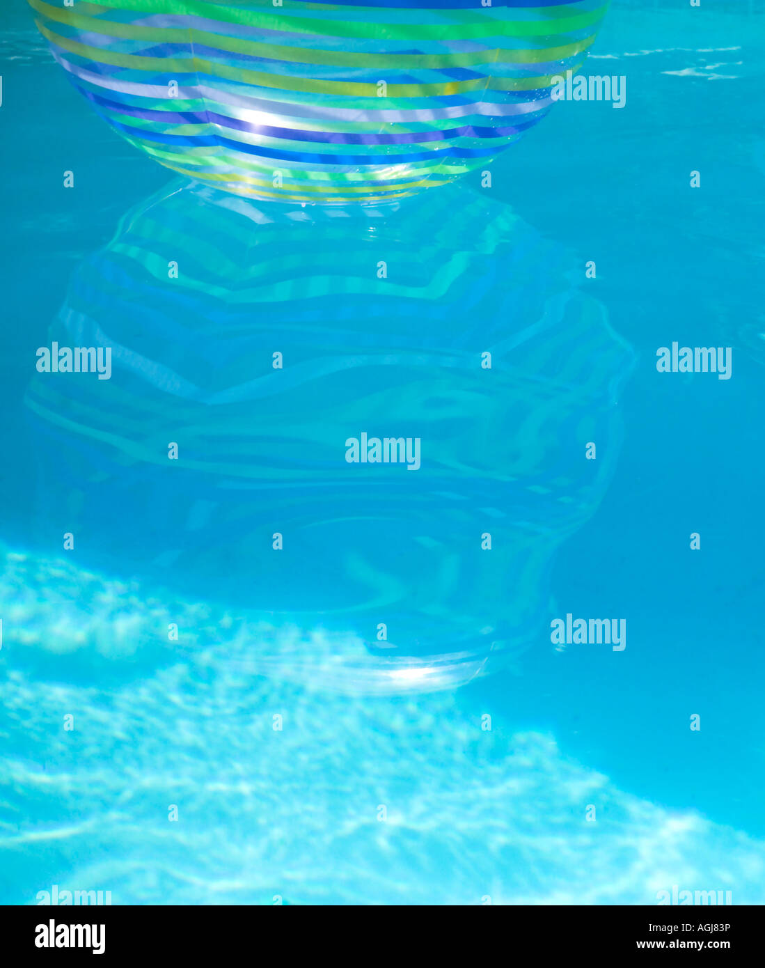 Reflection of a beach ball floating in swimming pool Stock Photo - Alamy