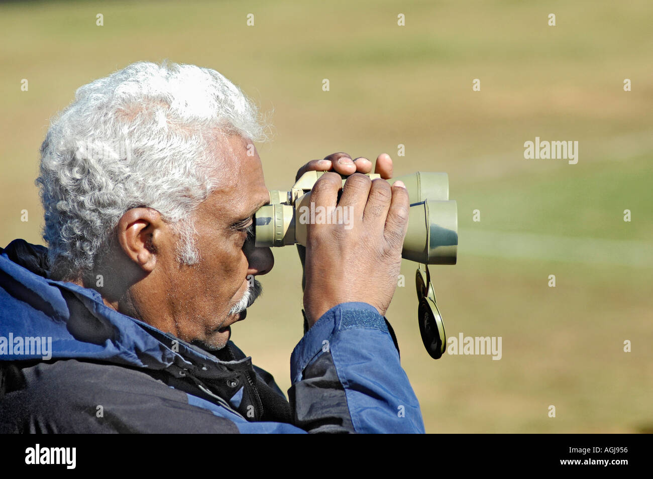 66 year old black man watching his grandson play football some with ... 66 year old black man watching his grandson play football some with ...