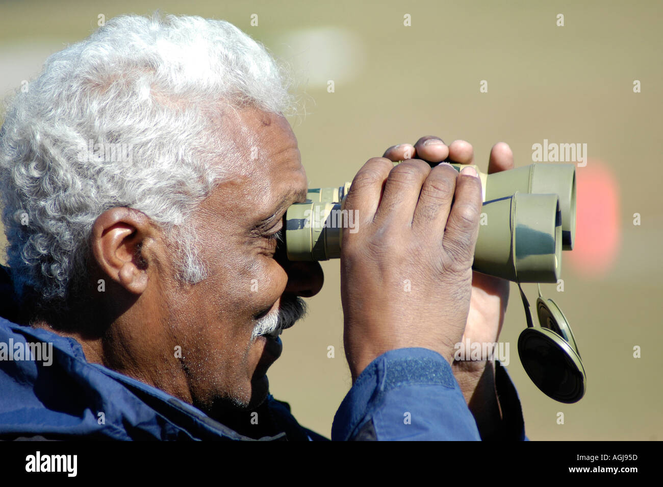 66 year old black man watching his grandson play football some with ... 66 year old black man watching his grandson play football some with ...
