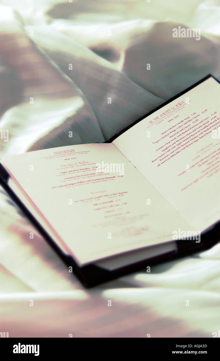 Room service menu on bed Stock Photo - Alamy