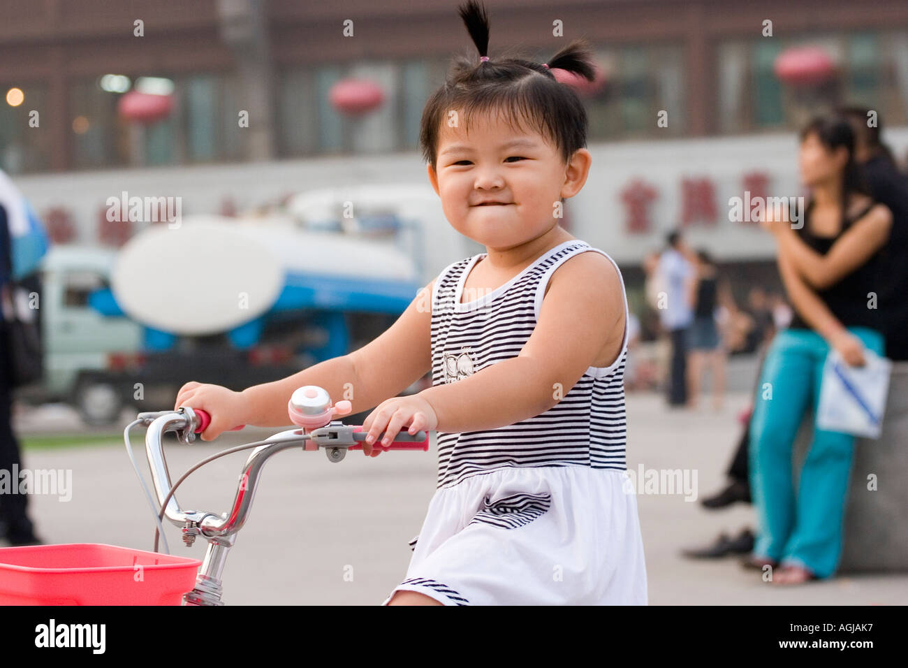 Chinese girl on bike hi-res stock photography and images - Alamy