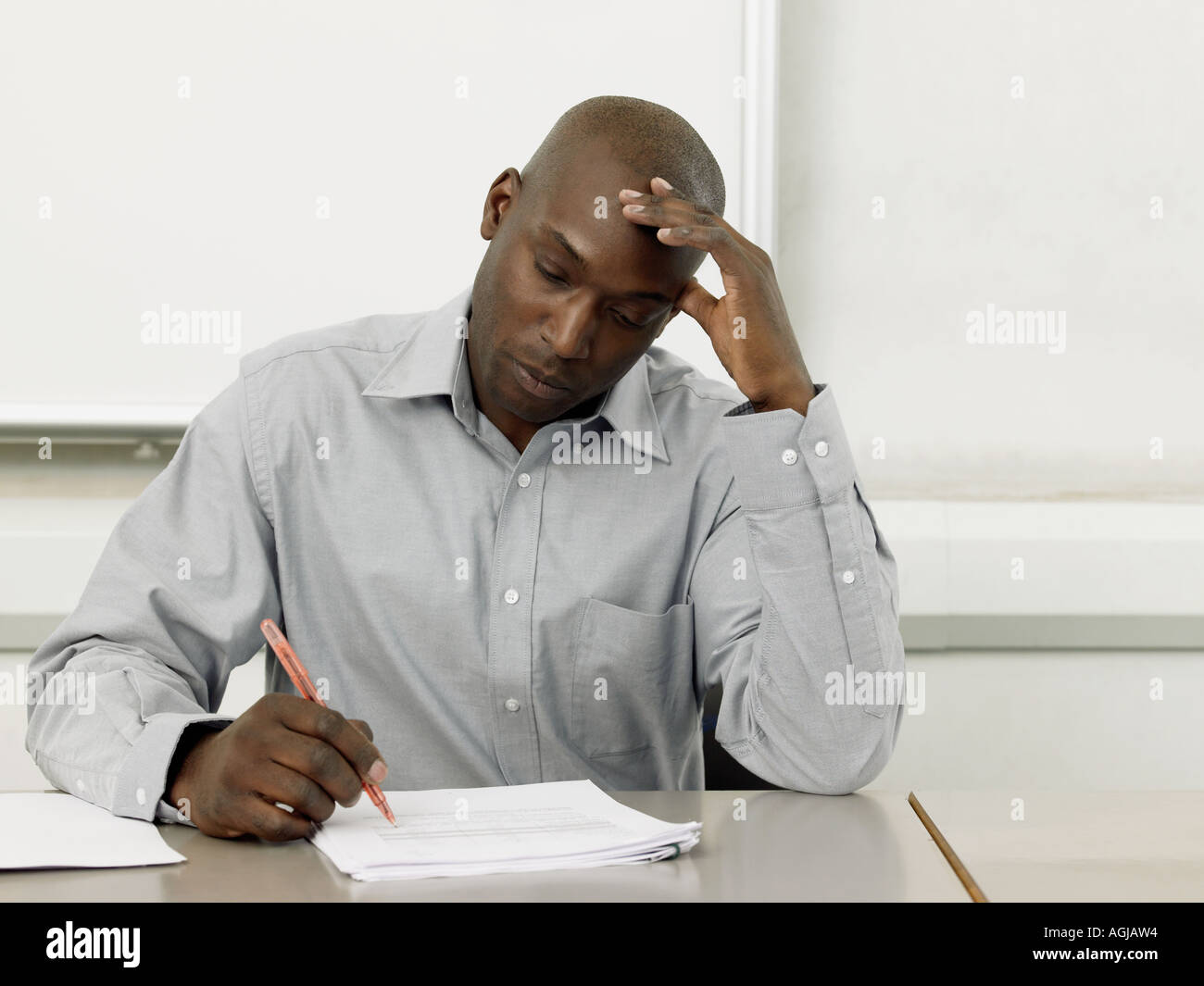 Teacher marking paperwork Stock Photo, Royalty Free Image: 8126995 - Alamy