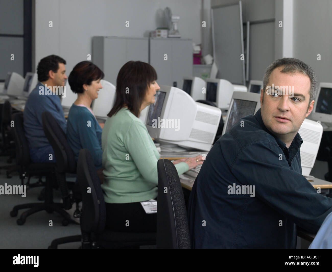 Mature students using computer Stock Photo - Alamy