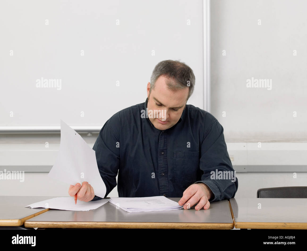 Teacher marking hi-res stock photography and images - Alamy