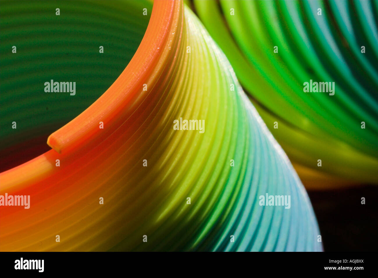 A childs toy slinky in closeup Stock Photo - Alamy