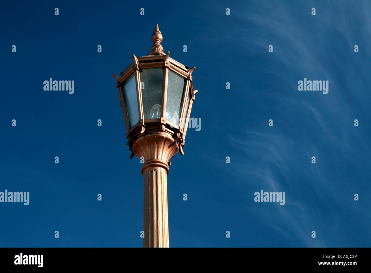 Colonial styled lightpole against a blue sky Stock Photo - Alamy