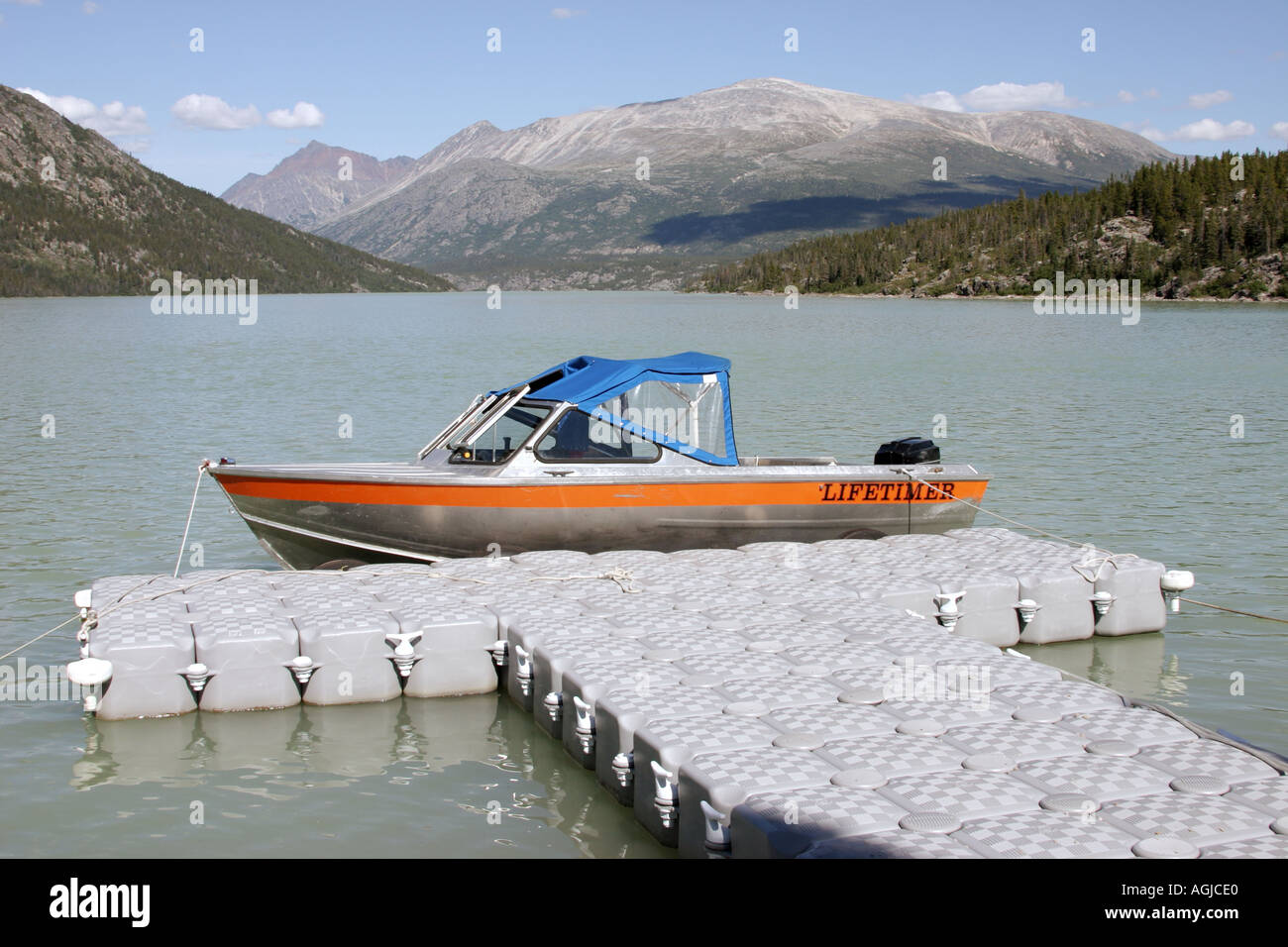 footbridge made aot of plastik pontoons and the motor boat of the ...