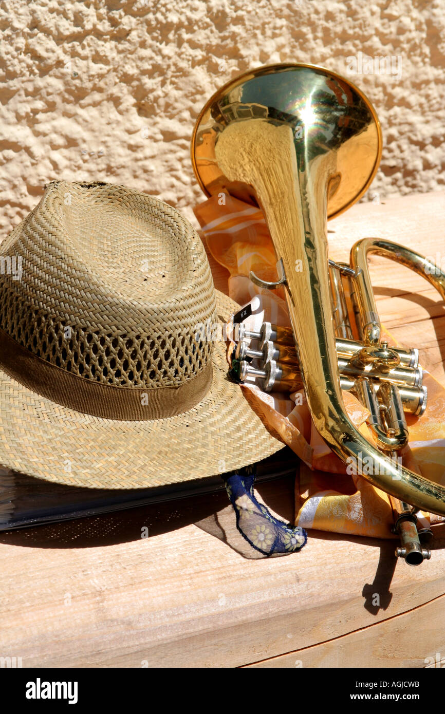straw hat and trumpet on a bench Bavaria Germany Stock Photo - Alamy