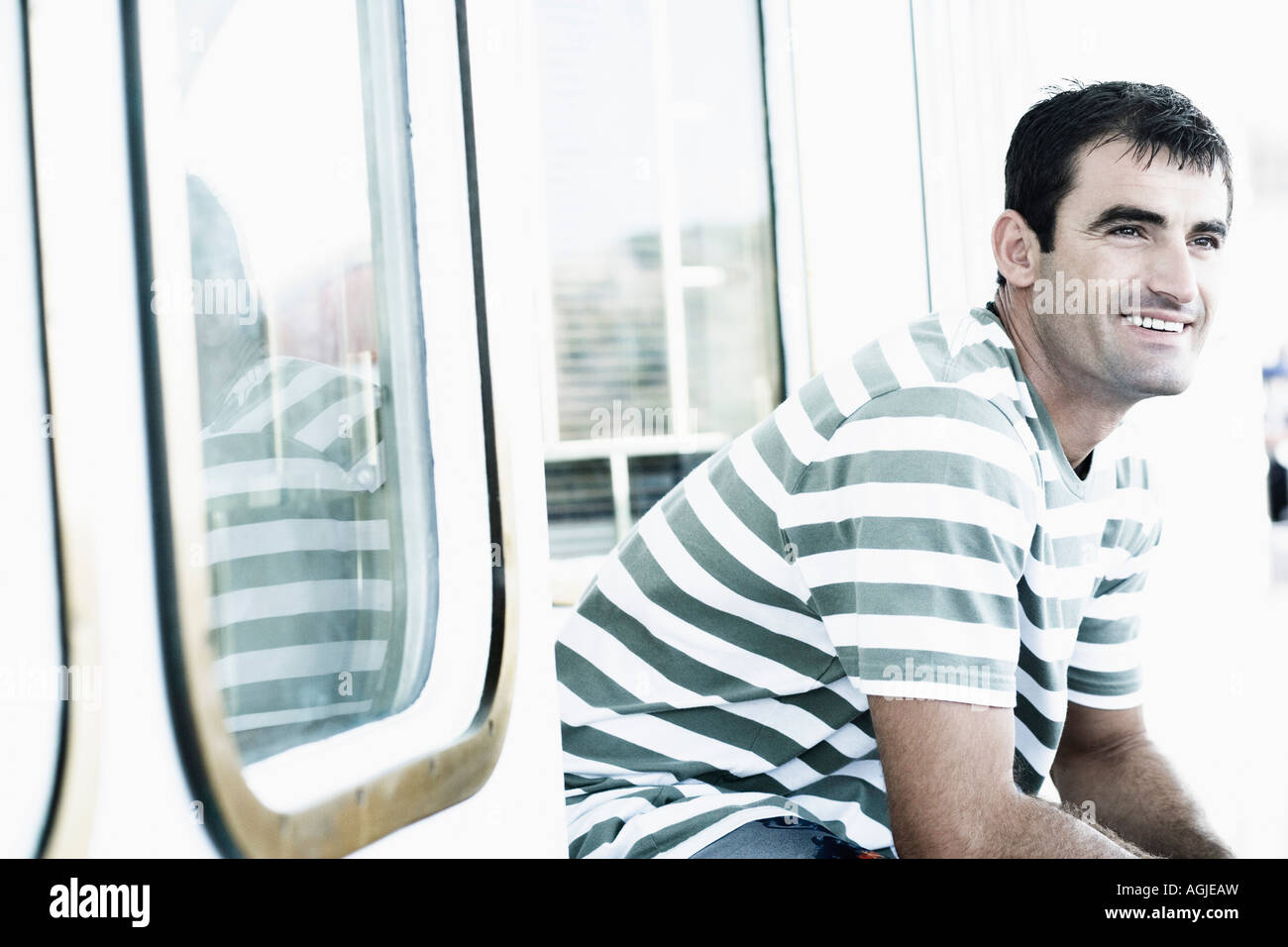 Side profile of a mid adult man on a sailing ship and smiling Stock ...