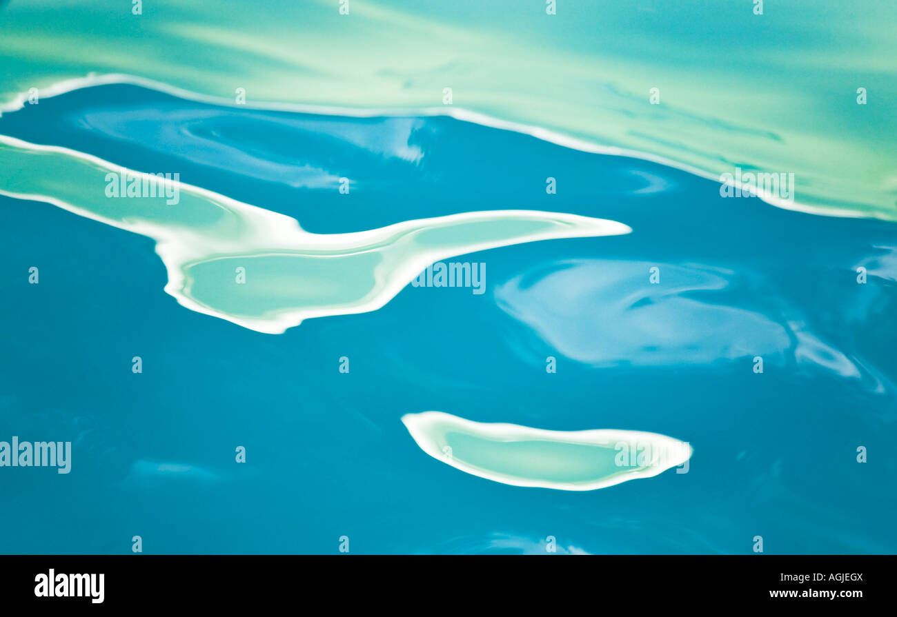 Reflection of green float in swimming pool Stock Photo - Alamy