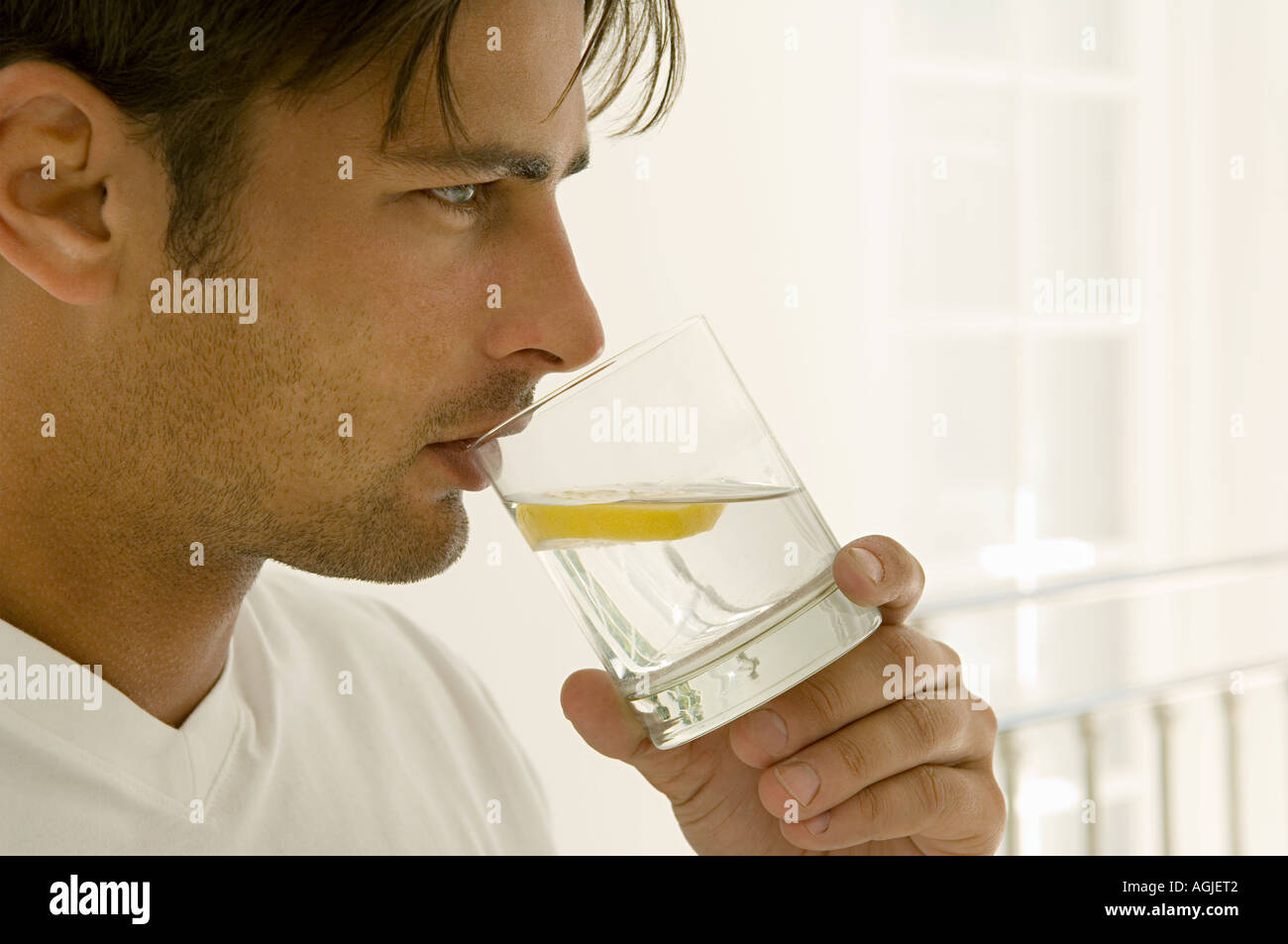 Man drinking water with lemon Stock Photo - Alamy