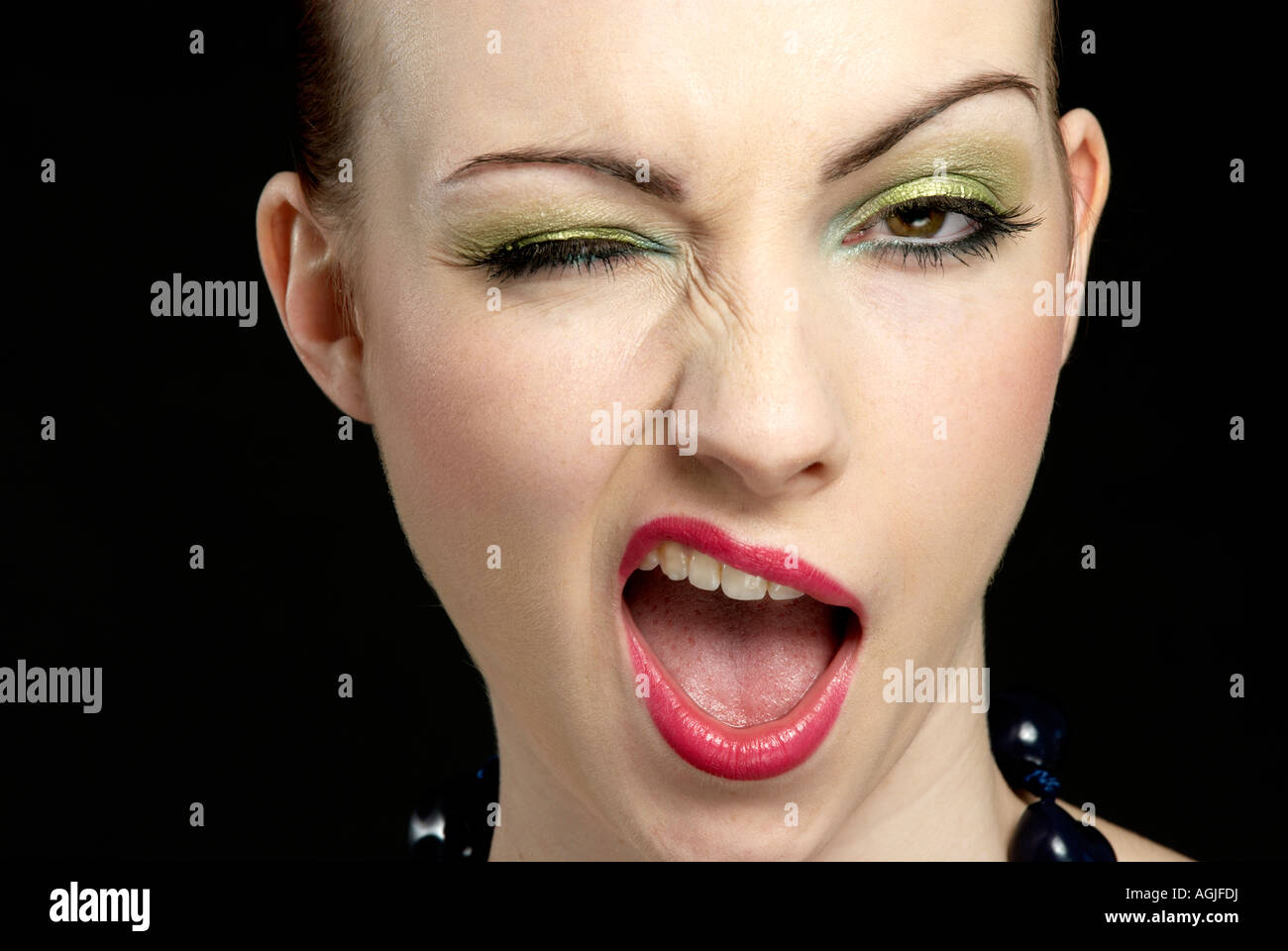 woman winking close up Stock Photo - Alamy