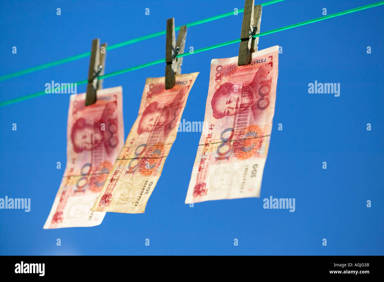 China Chinese Yuan Currency Notes pegged to washing line Stock Photo ...