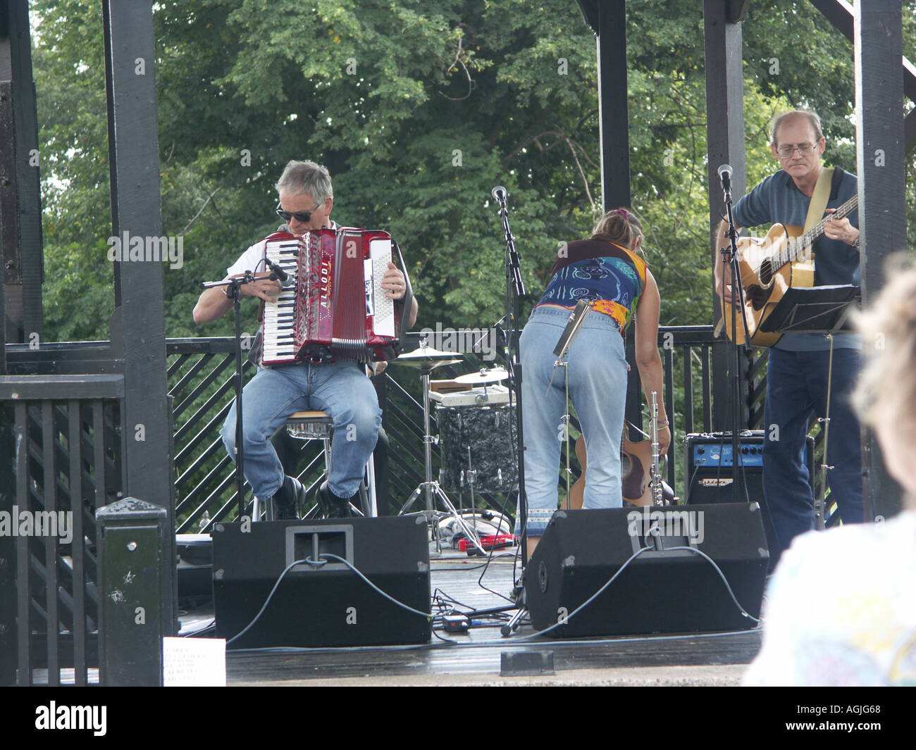 An outdoor musical performance by various musicians in the traditional ...
