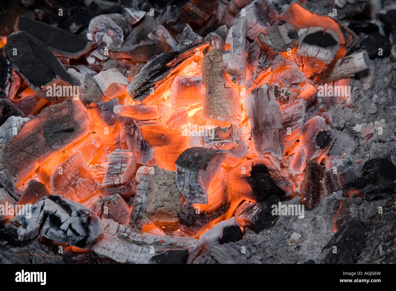 burning coal in preparation to cook barbeque Stock Photo - Alamy
