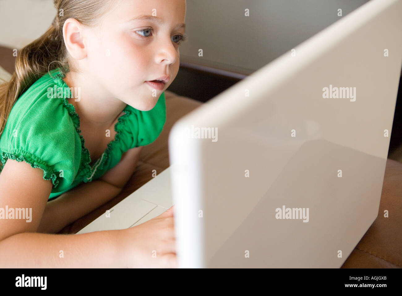 Girl using laptop computer Stock Photo - Alamy
