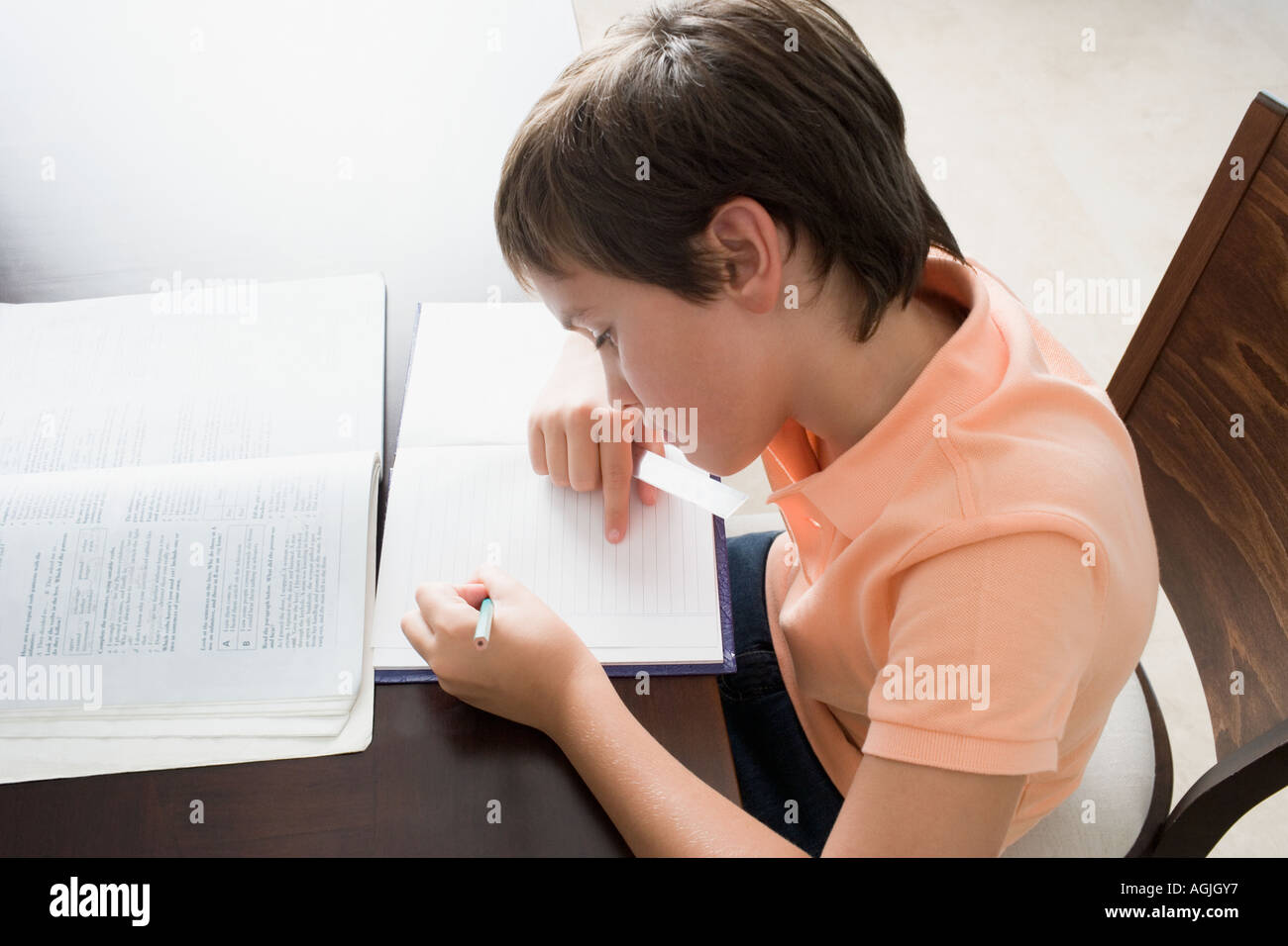 Boy doing homework Stock Photo - Alamy