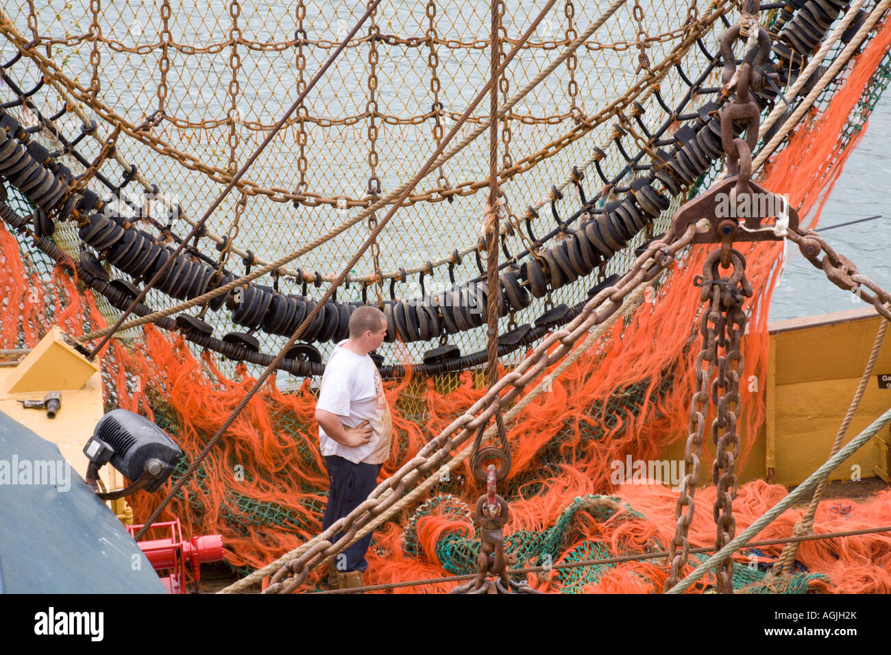 Routine maintenance and sorting the nets on board a trawler moored in ...