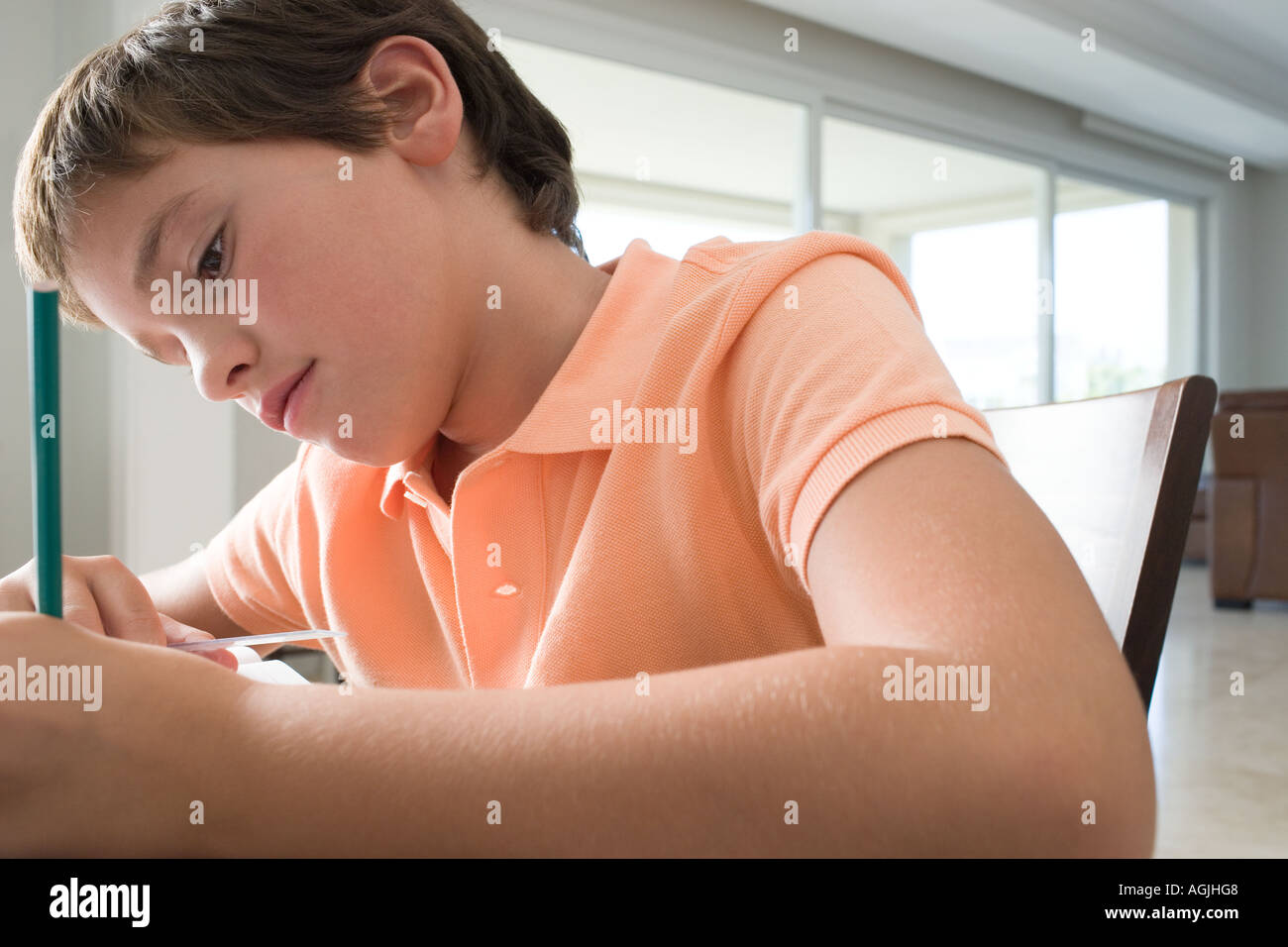 Boy doing homework Stock Photo - Alamy
