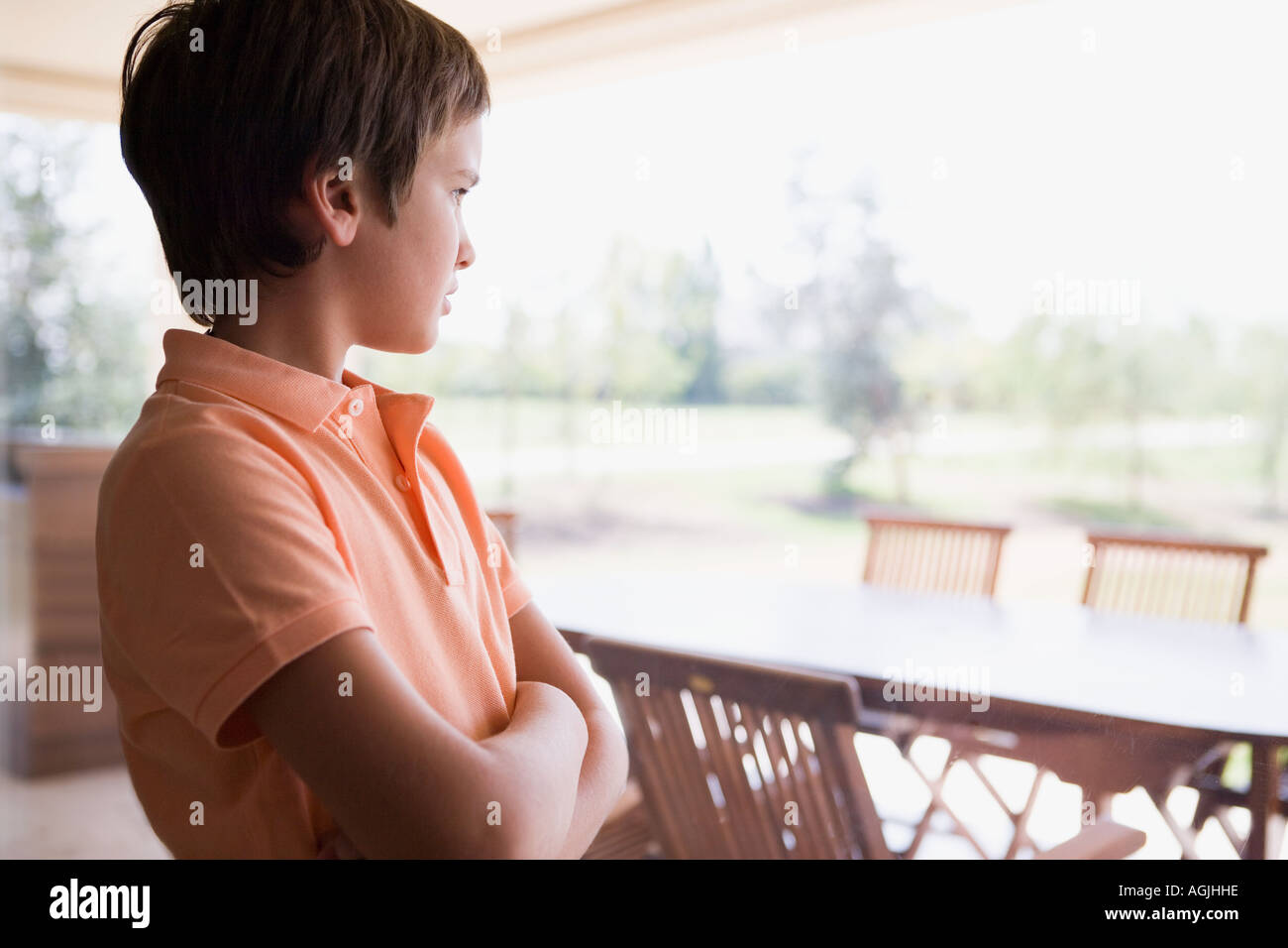 Boy with crossed arms Stock Photo - Alamy