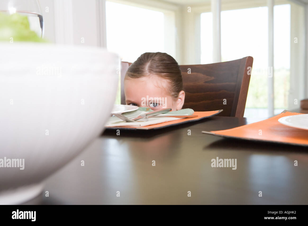 Girl at dinner table Stock Photo - Alamy