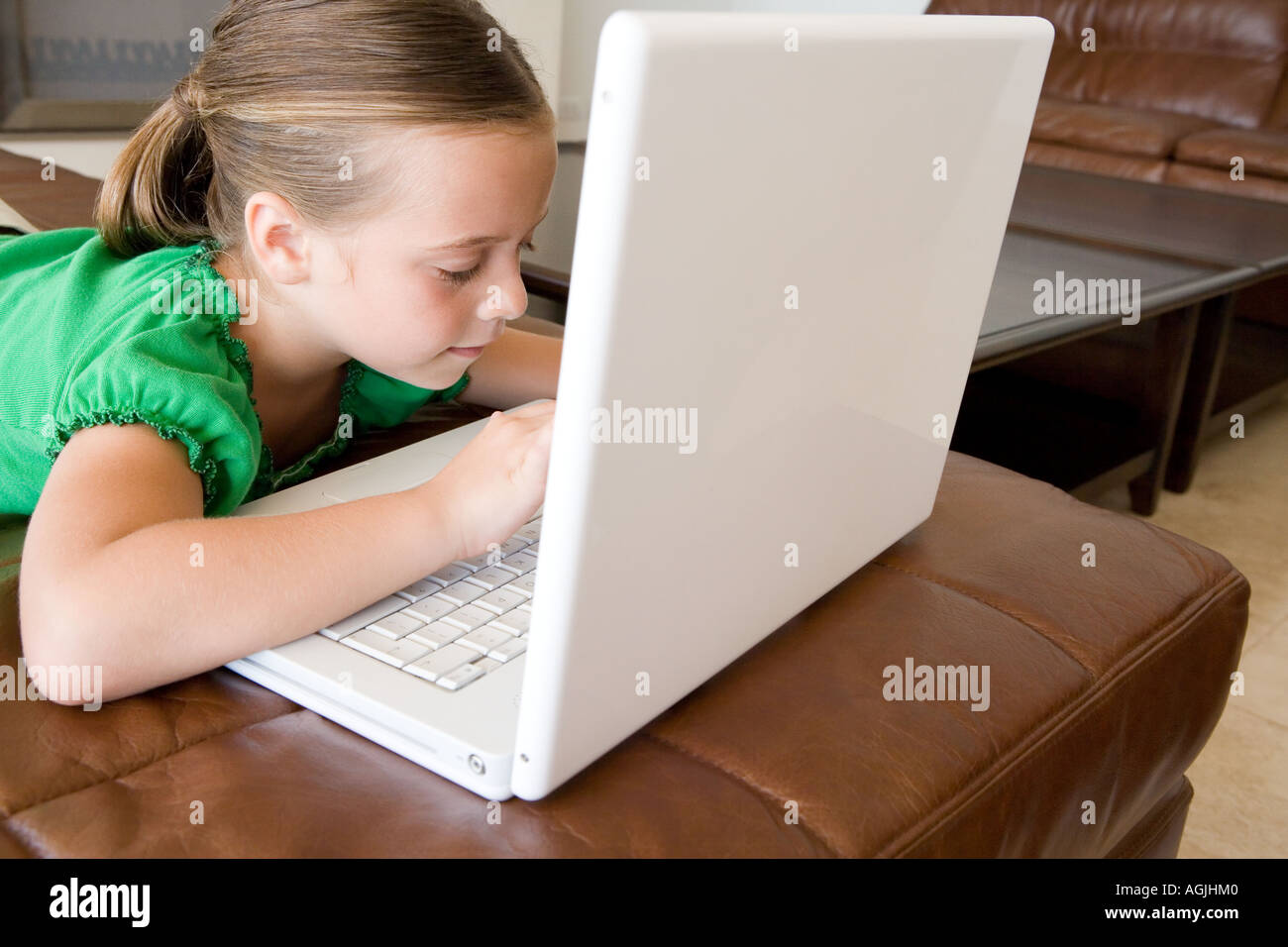 Girl using laptop Stock Photo - Alamy