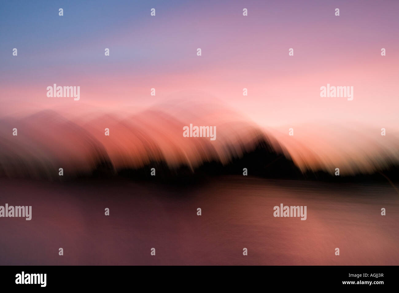 Rolling ocean waves in motion at sunset Stock Photo - Alamy