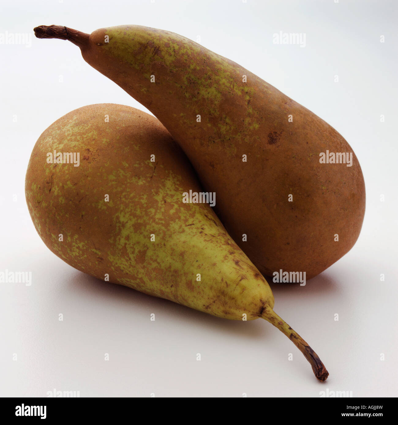 Two whole pears on a white background Stock Photo - Alamy