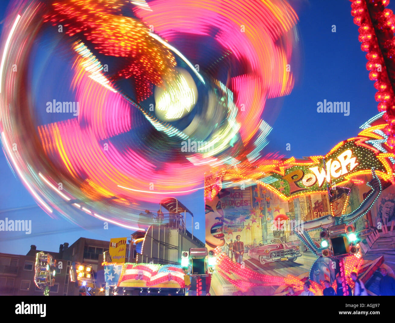 colourful fairground ride at dusk Stock Photo - Alamy
