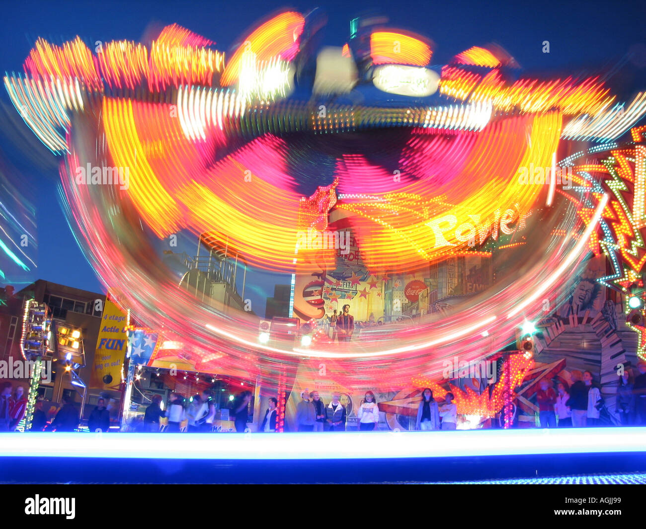colourful fairground ride at dusk Stock Photo - Alamy