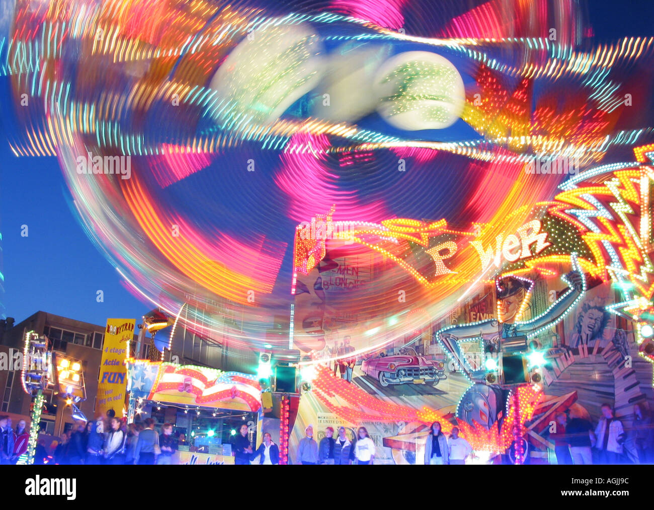 colourful fairground ride at dusk Stock Photo - Alamy