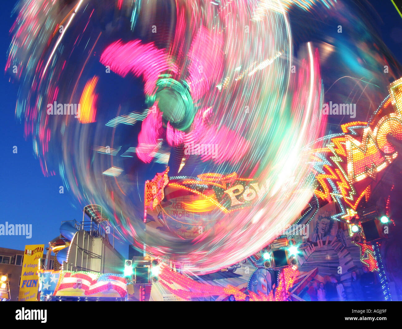 colourful fairground ride at dusk Stock Photo - Alamy