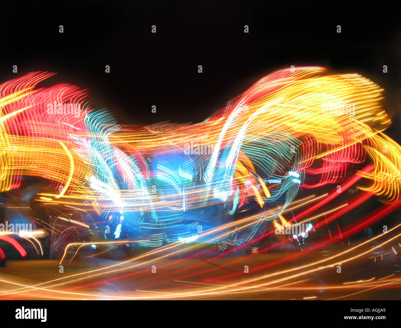 abstract light streaks at fairground at night Stock Photo - Alamy