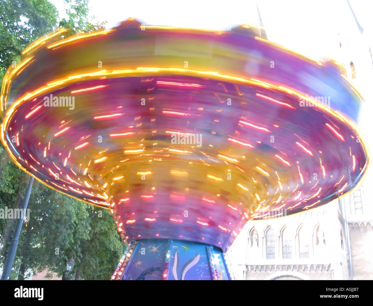 fairground carousel with soft pastel colours in full swing Stock Photo ...