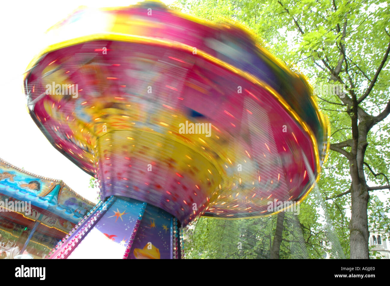 fairground carousel in motion in frog eye perspective Stock Photo - Alamy