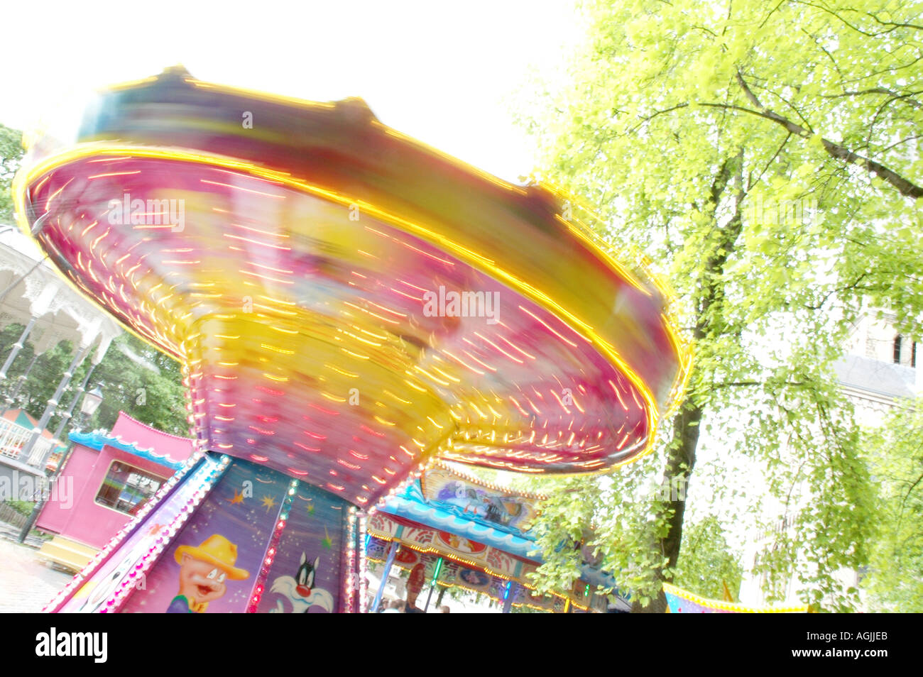 high key image of vintage fairground carousel in motion Stock Photo - Alamy