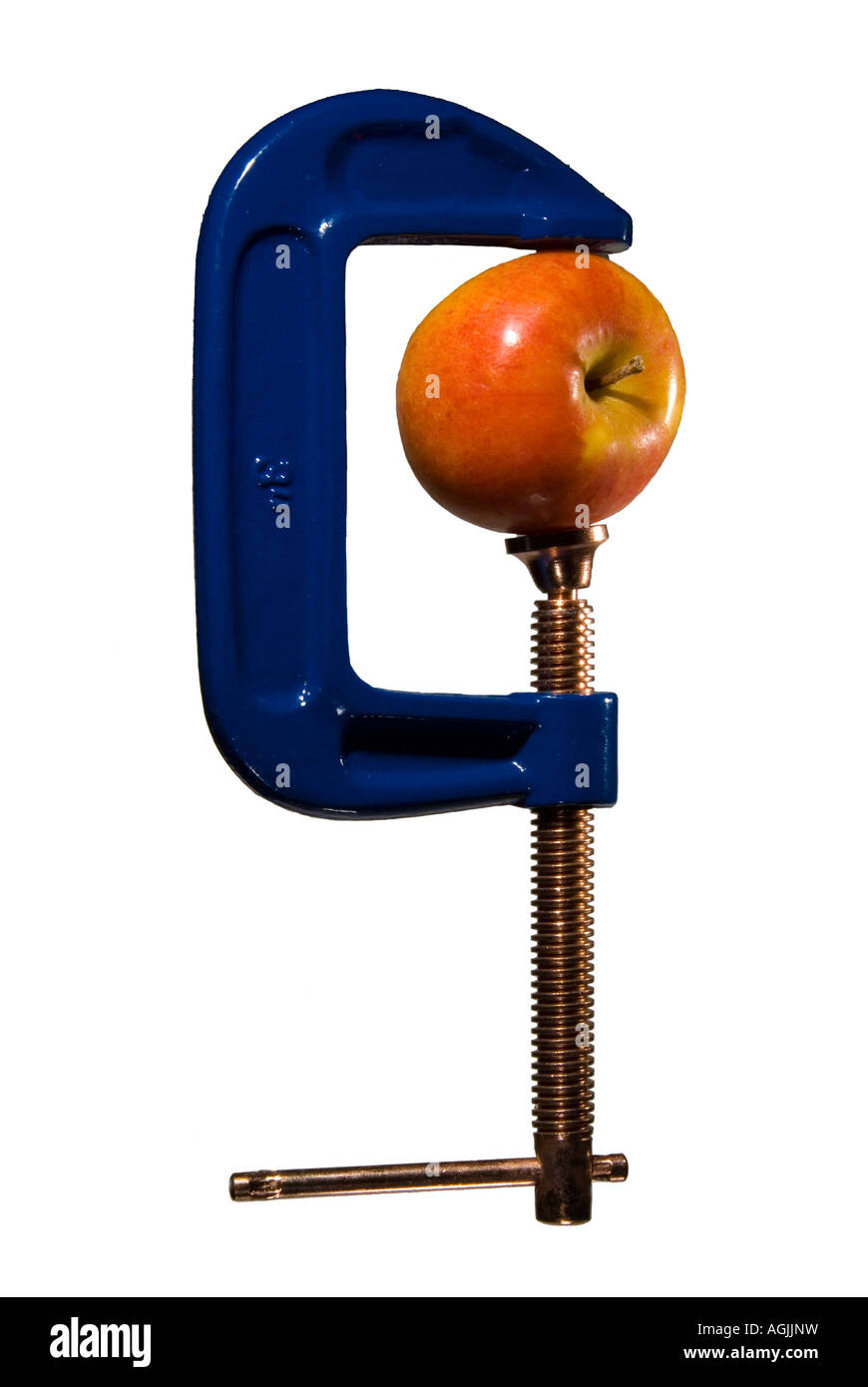 An Apple held within a C Clamp Stock Photo - Alamy