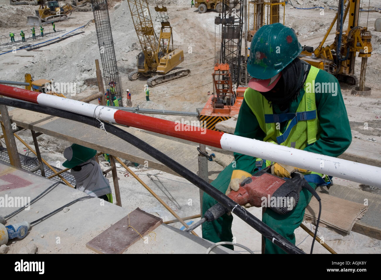 worker preparing for concrete rebar filling by drilling into reinforced ...