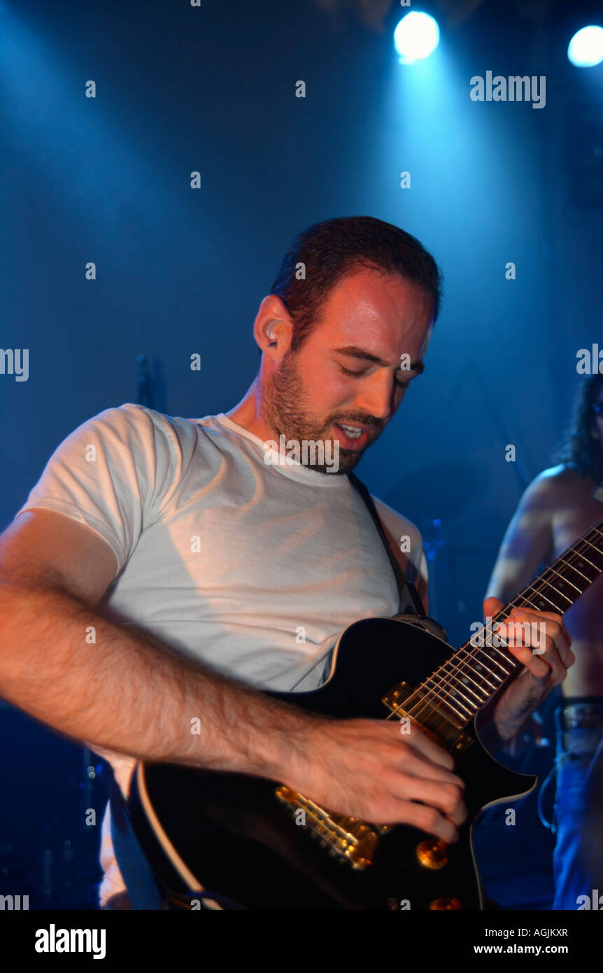 Ben Hyman playing guitar during a live show for the Humble Kings tour ...