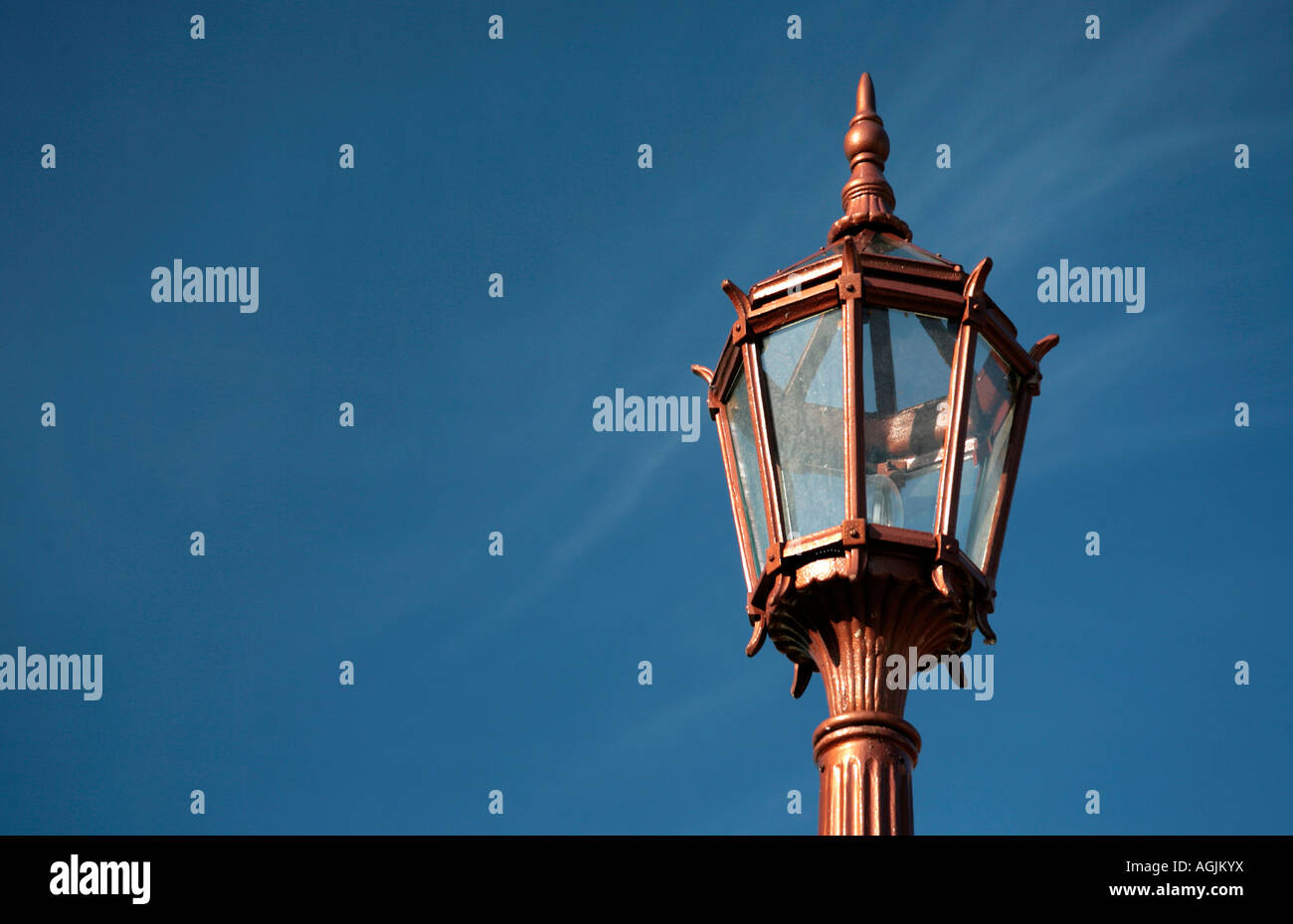 Colonial styled lightpole against a blue sky Stock Photo - Alamy