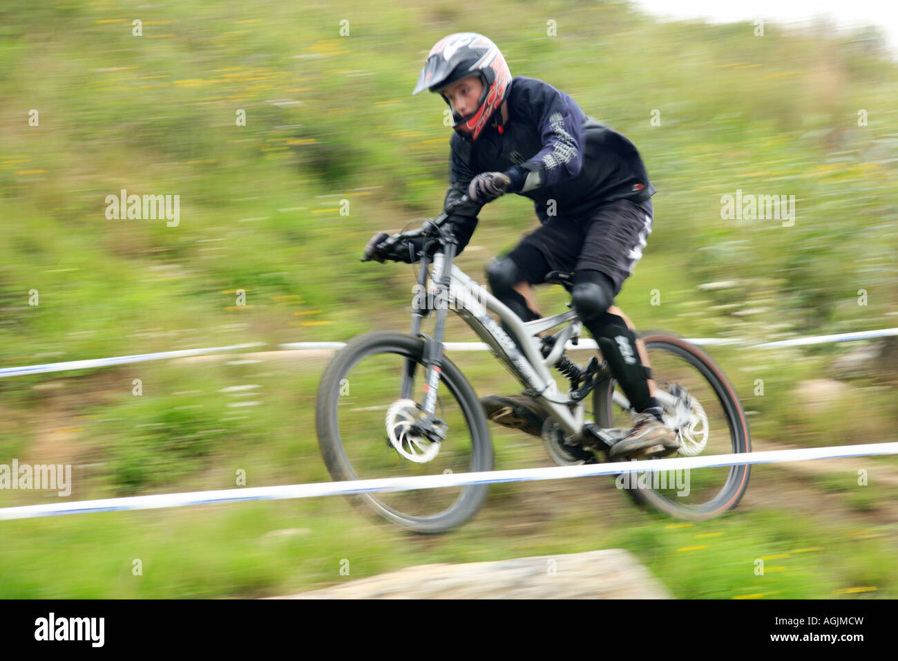 young boy with his mountain bike taking part in a downhill race Stock ...