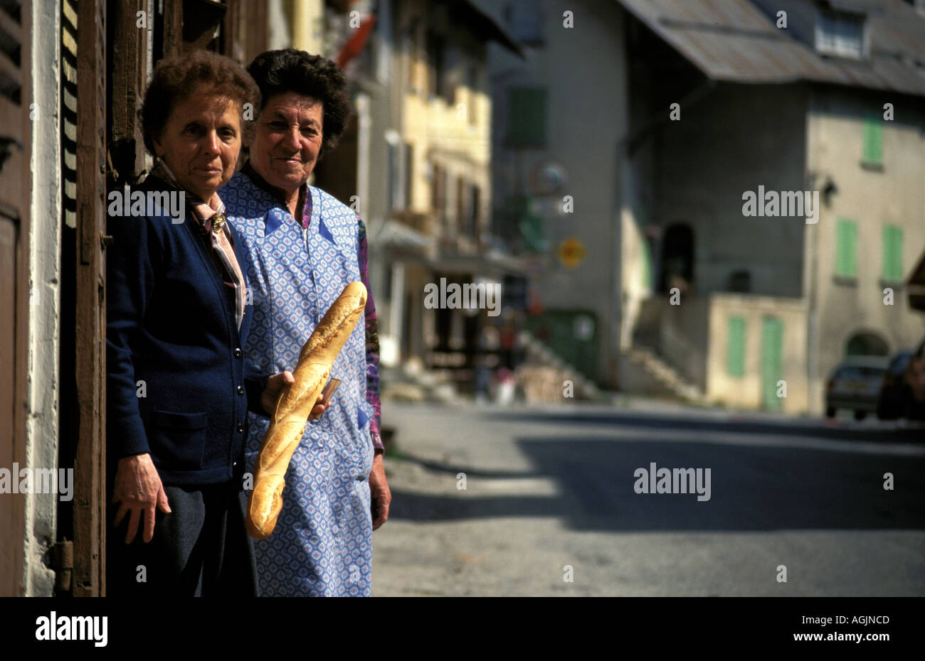 Two women with french bread hi-res stock photography and images - Alamy