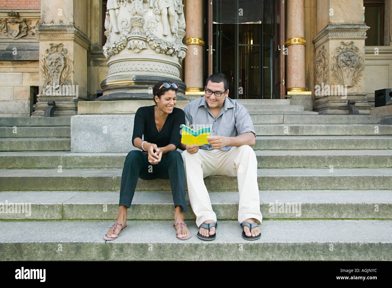 Tourist couple on museum steps Stock Photo - Alamy
